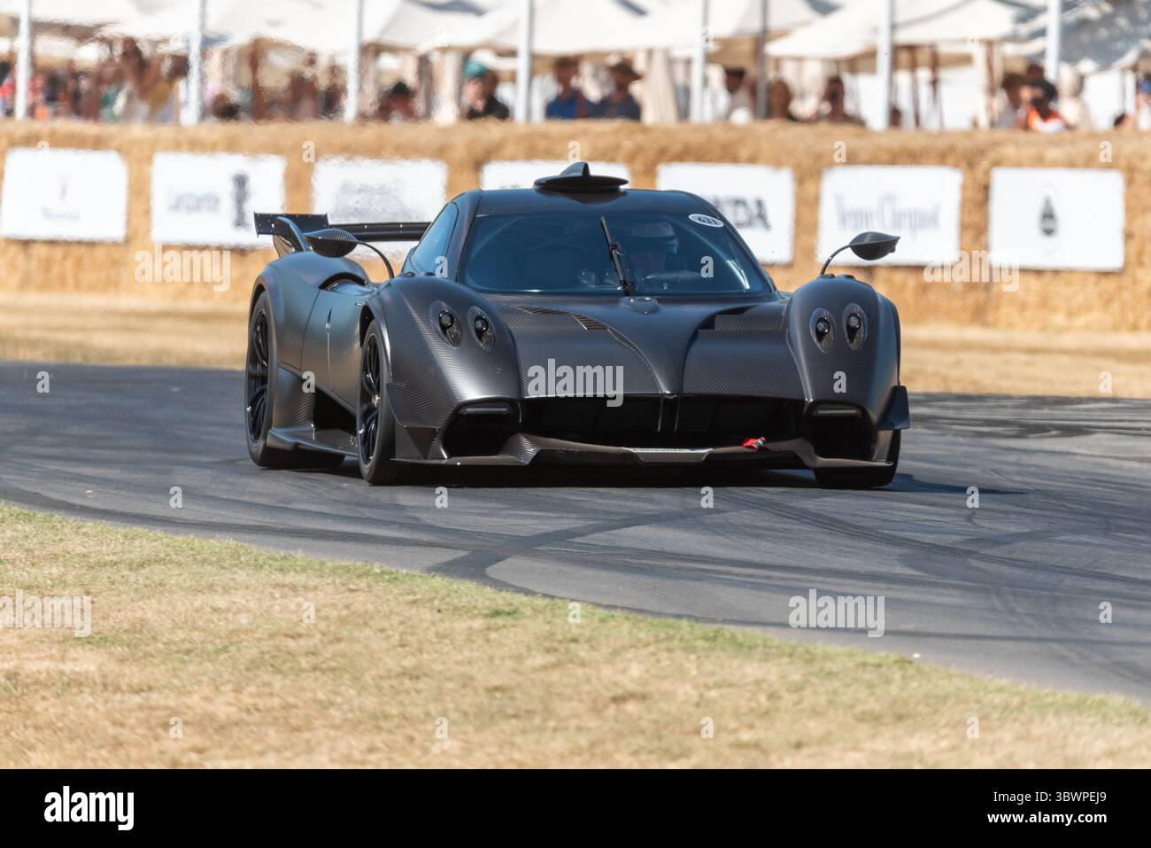 Pagani Huayra R by Lanzante sports car driving up the hillclimb track ...