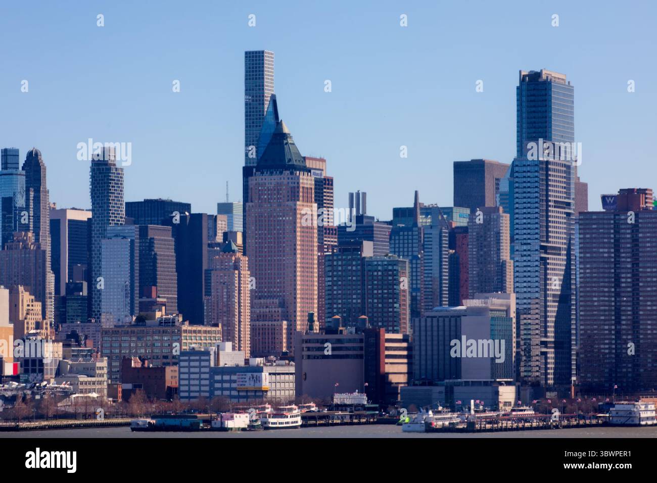 Jersey City view of Manhattan’s glowing waterfront skyline at sunrise ...