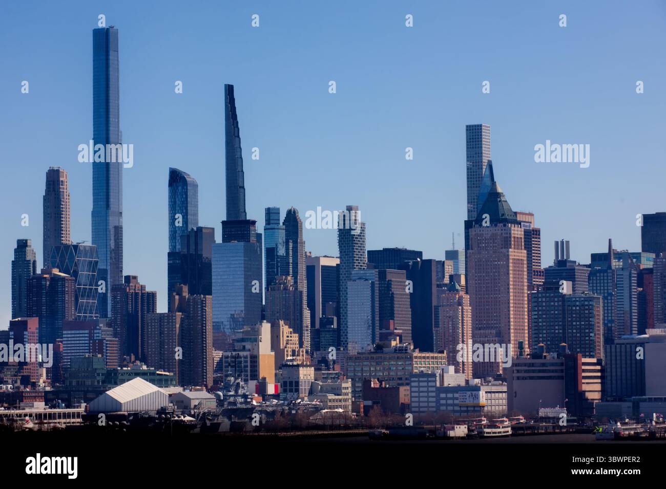Jersey City view of Manhattan’s glowing waterfront skyline at sunrise ...
