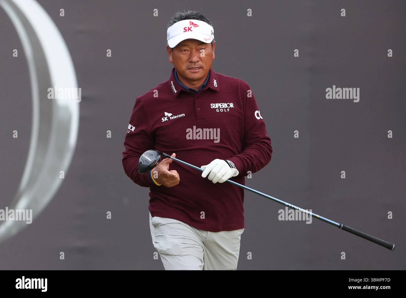 KJ Choi of Korea walks off the 1st tee after playing his shot during the first round of the ...