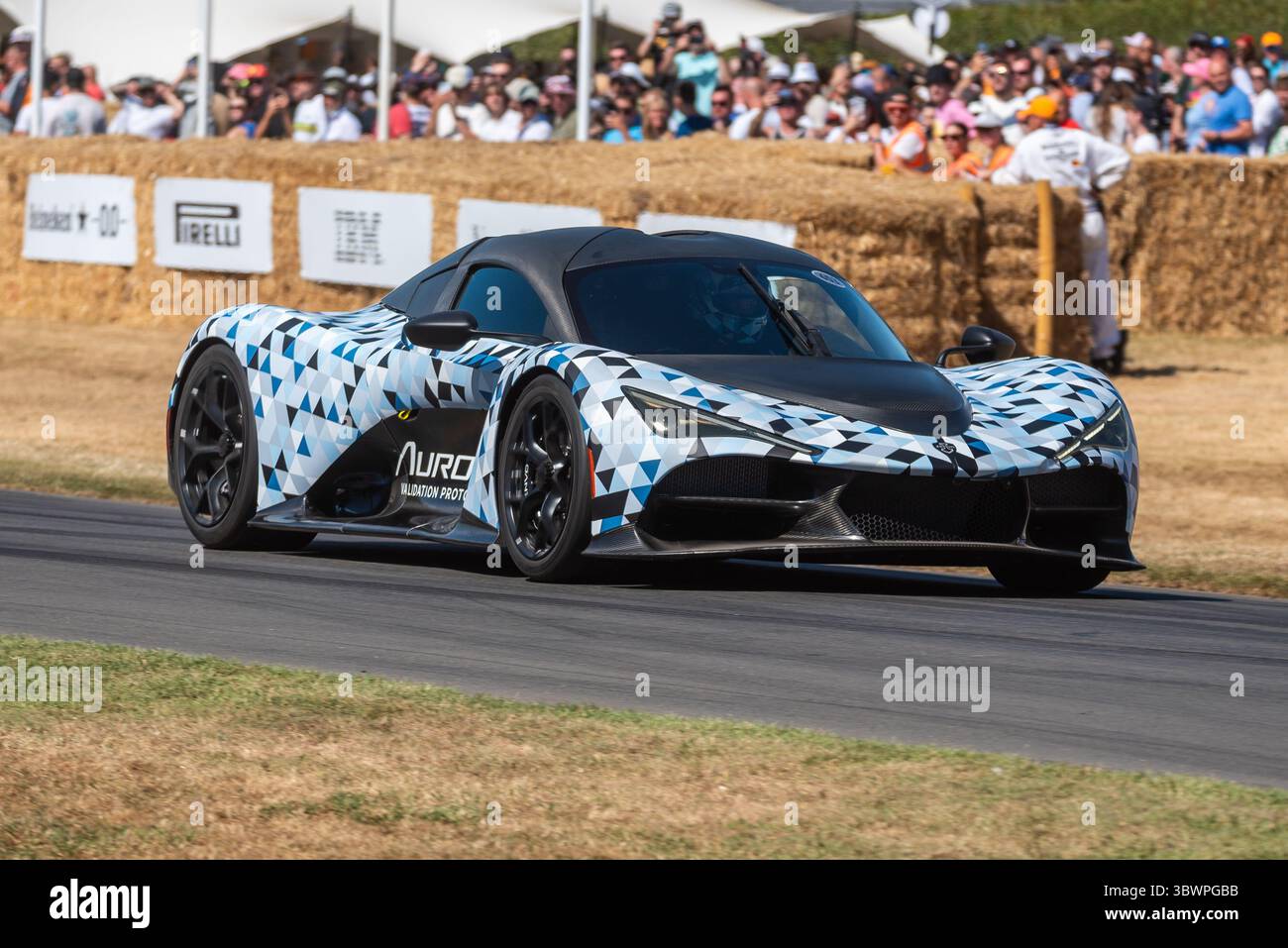 Zenvo Aurora Tur sports car driving up the hillclimb track at the ...