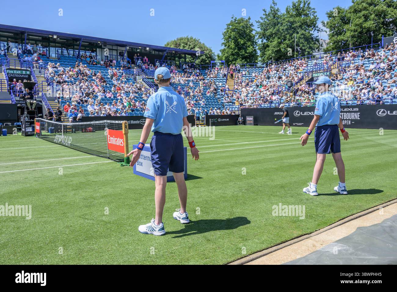 Lexus Eastbourne Open tennis 2025. Ball boys on Centre Court between ...