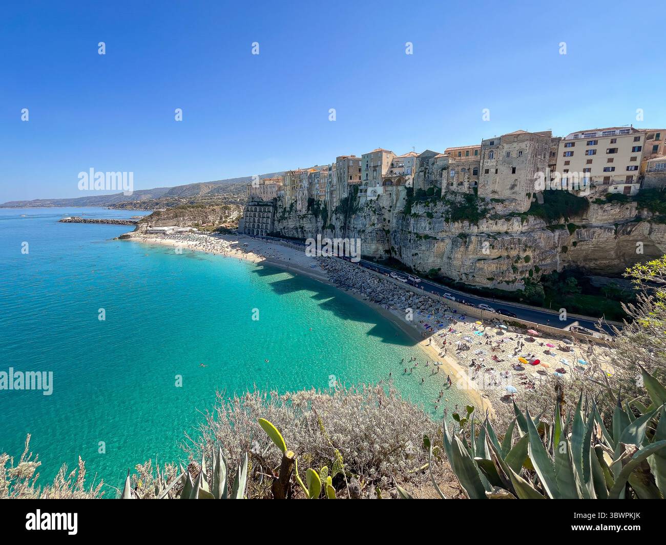 Panoramic view of Tropea beach in Italy, with turquoise sea, beachgoers ...