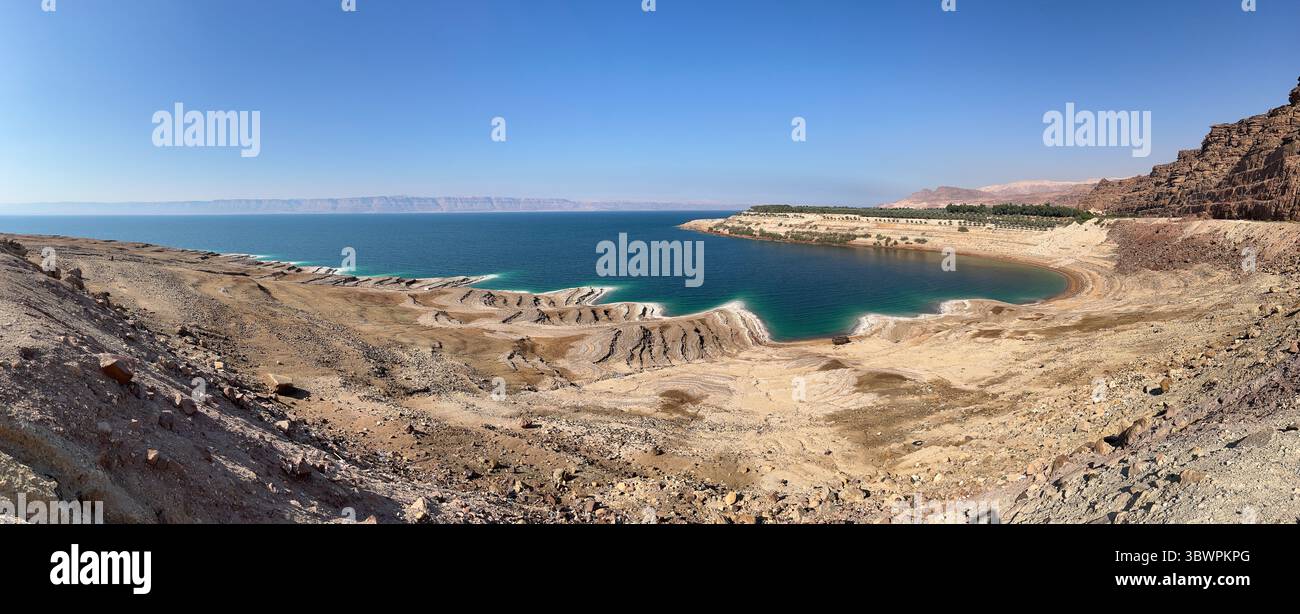 Panoramic view of the Dead Sea shoreline in Jordan with salt patterns ...
