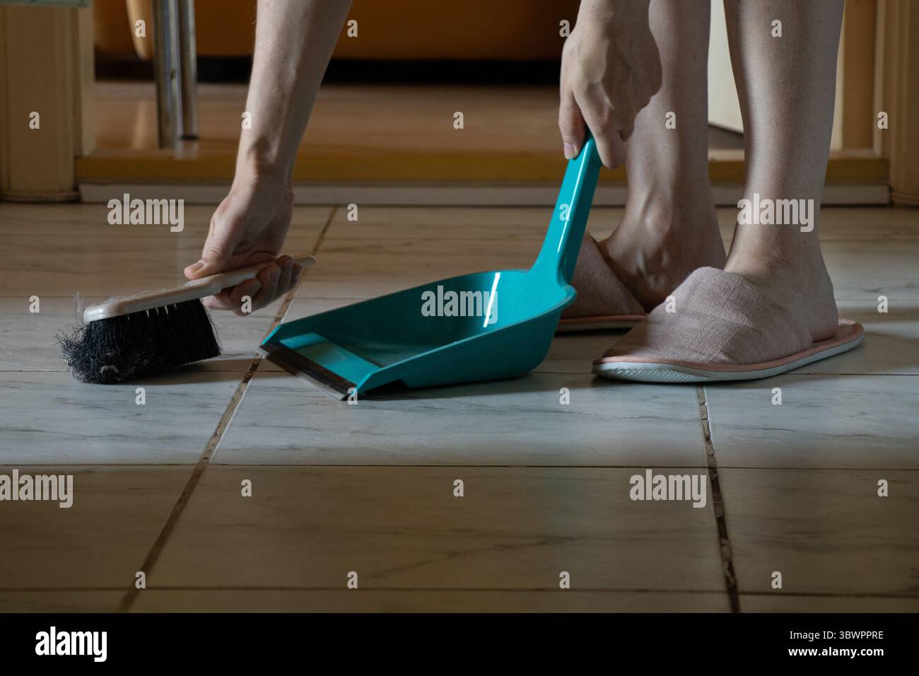 Woman sweeping floor slippers hi-res stock photography and images - Alamy
