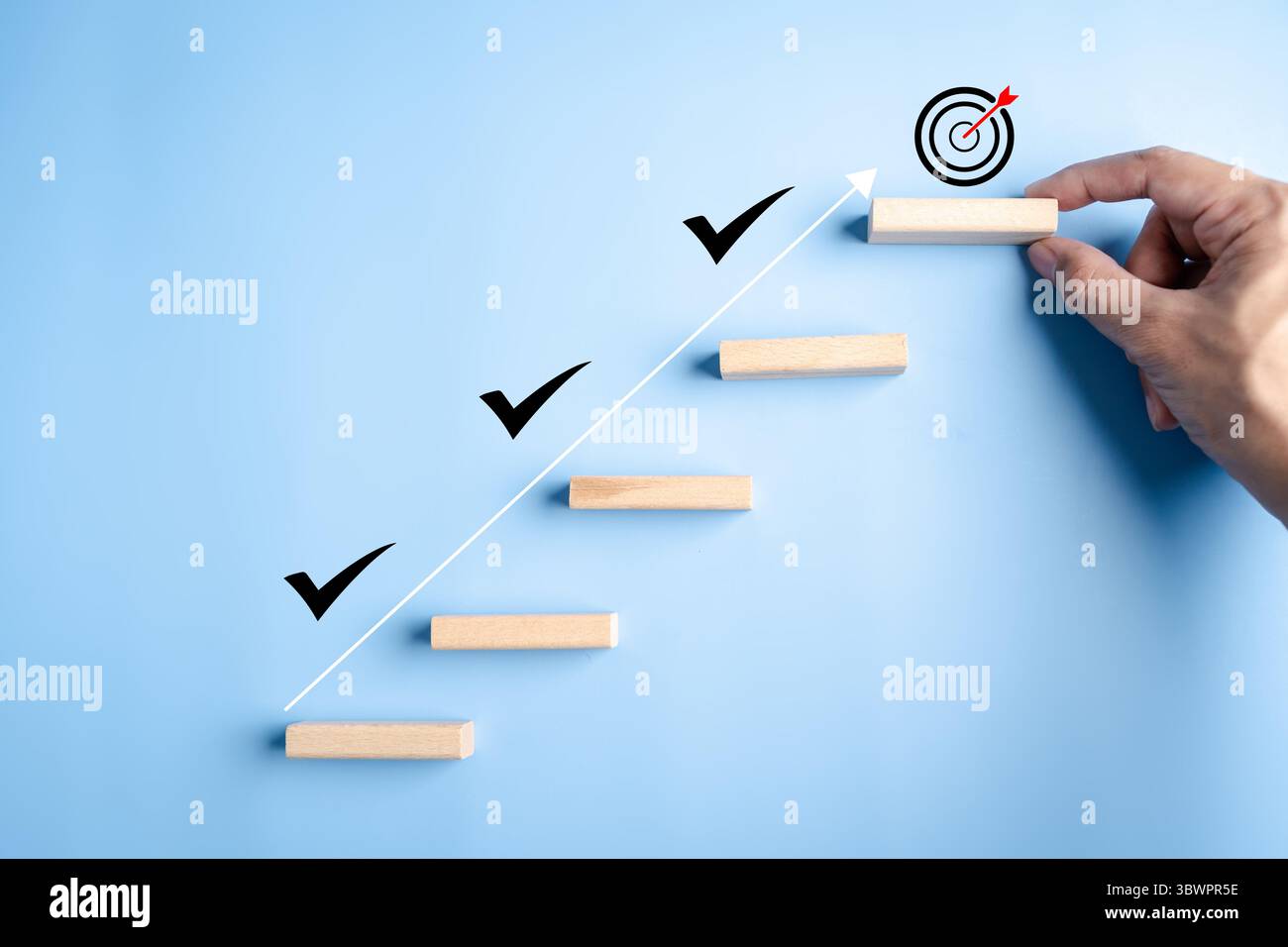 Business growth success and achievement with hand arranging wooden steps and check marks, goal ...