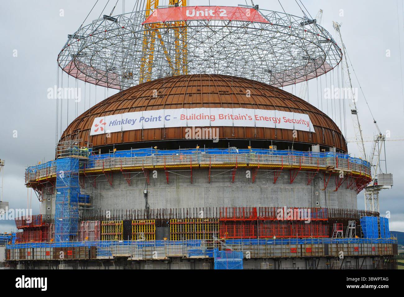 Engineering teams use the world's largest crane - Big Carl - to lift a 245-tonne steel dome onto ...