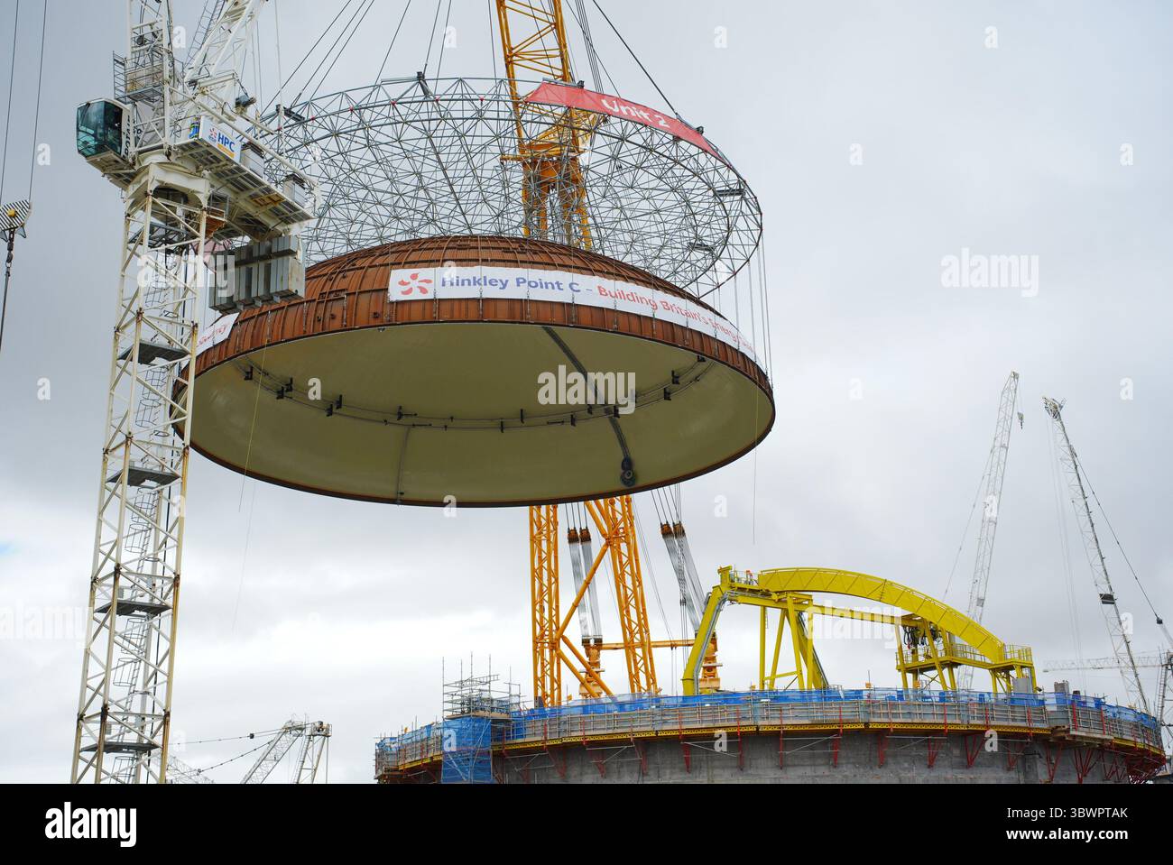 Engineering teams use the world's largest crane - Big Carl - to lift a 245-tonne steel dome onto ...