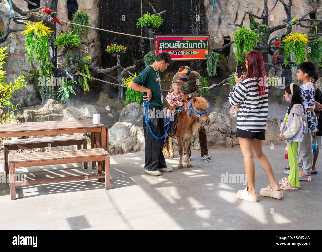 July 13, 2025, Bangkok, Thailand: People take photos at Pata Zoo in the ...