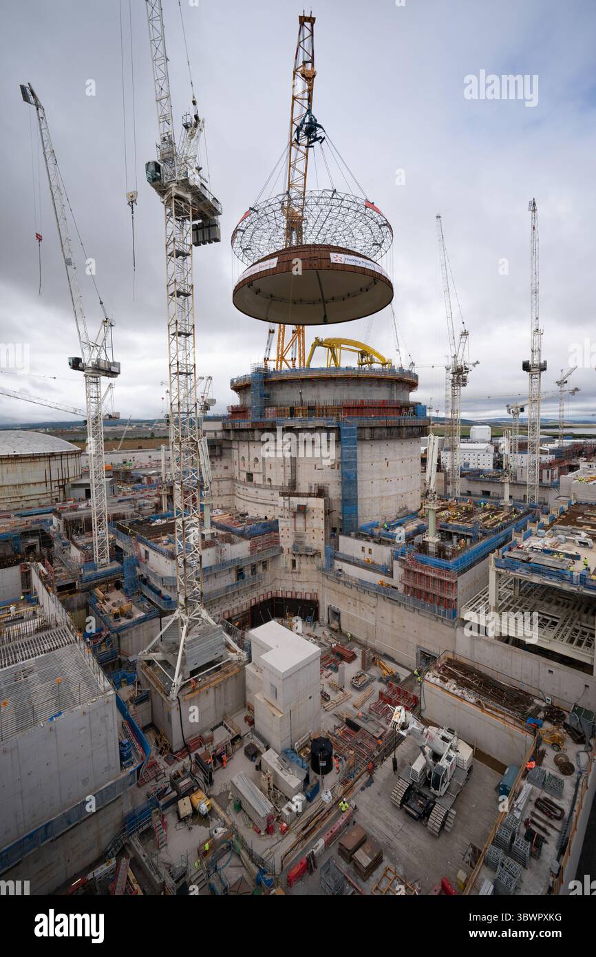 Engineering teams use the world's largest crane - Big Carl - to lift a 245-tonne steel dome onto ...