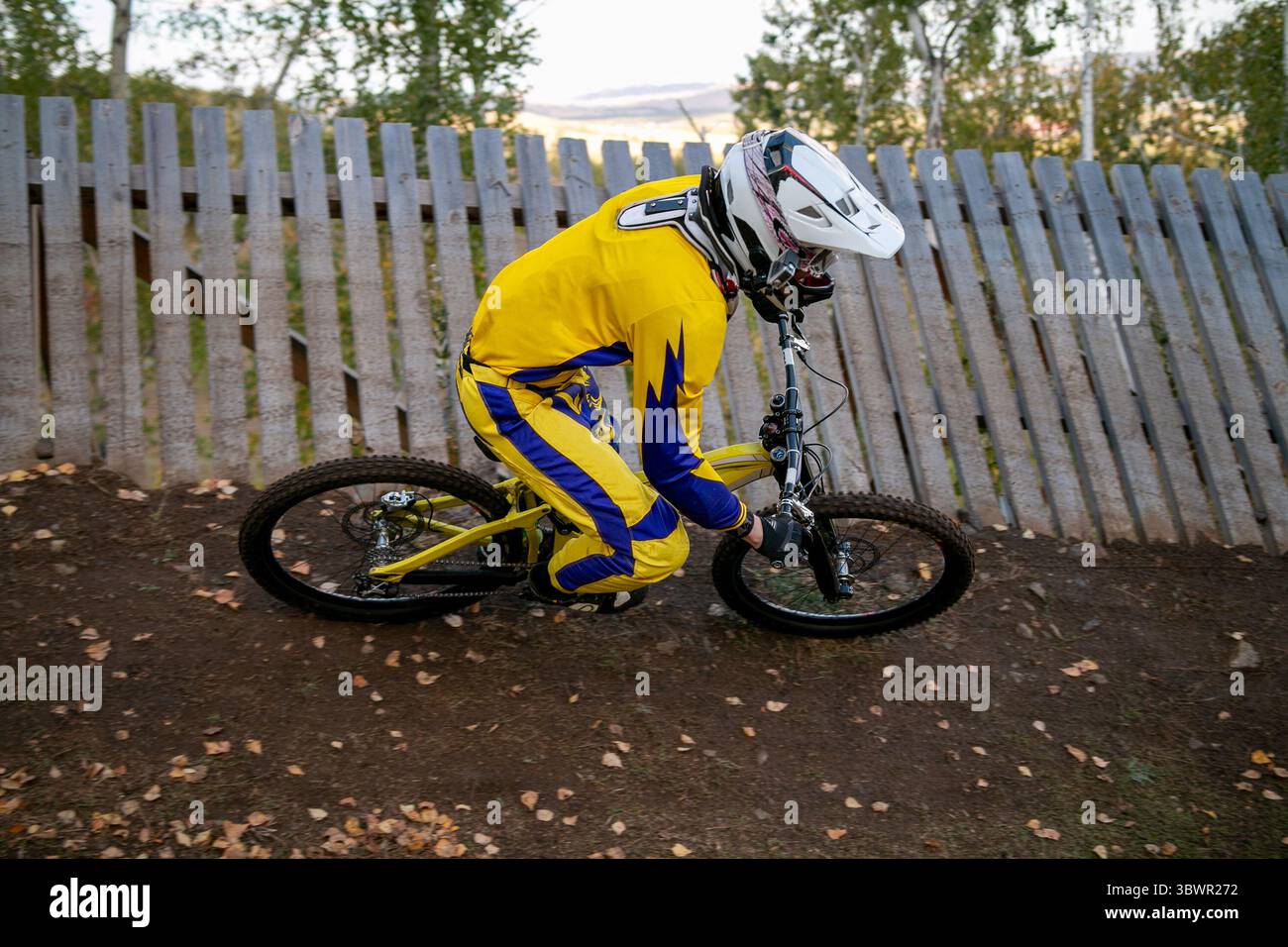 extreme mountain biker riding downhill on turn trail during race ...
