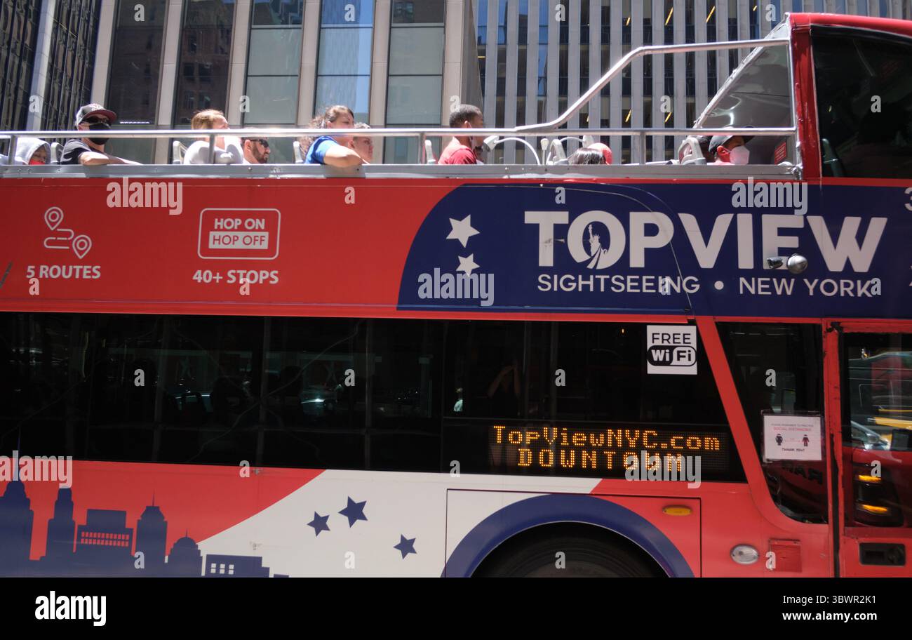 June 24, 2021, Brooklyn, New York, USA: Double decker tourist buses in Midtown Manhattan. New ...