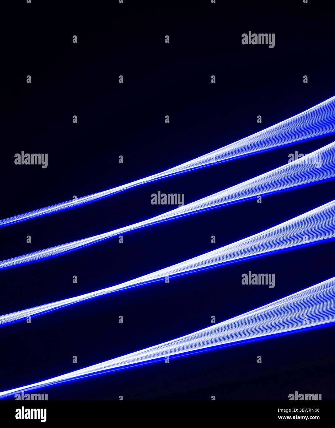 Three parallel blue streaks of light converging on a black background ...