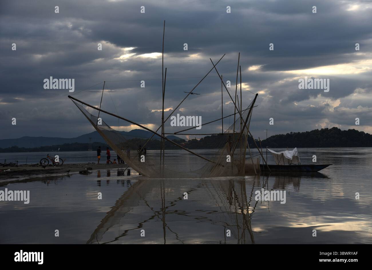July 8, 2021, Guwahati, Guwahati, India: Indian fisherman spread his ...