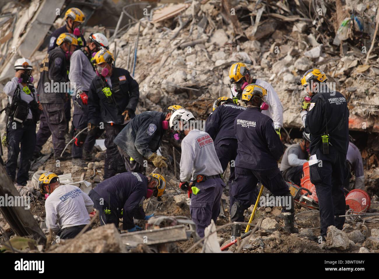 July 8, 2021 - Surfside, Florida, USA - Search and Rescue teams look ...