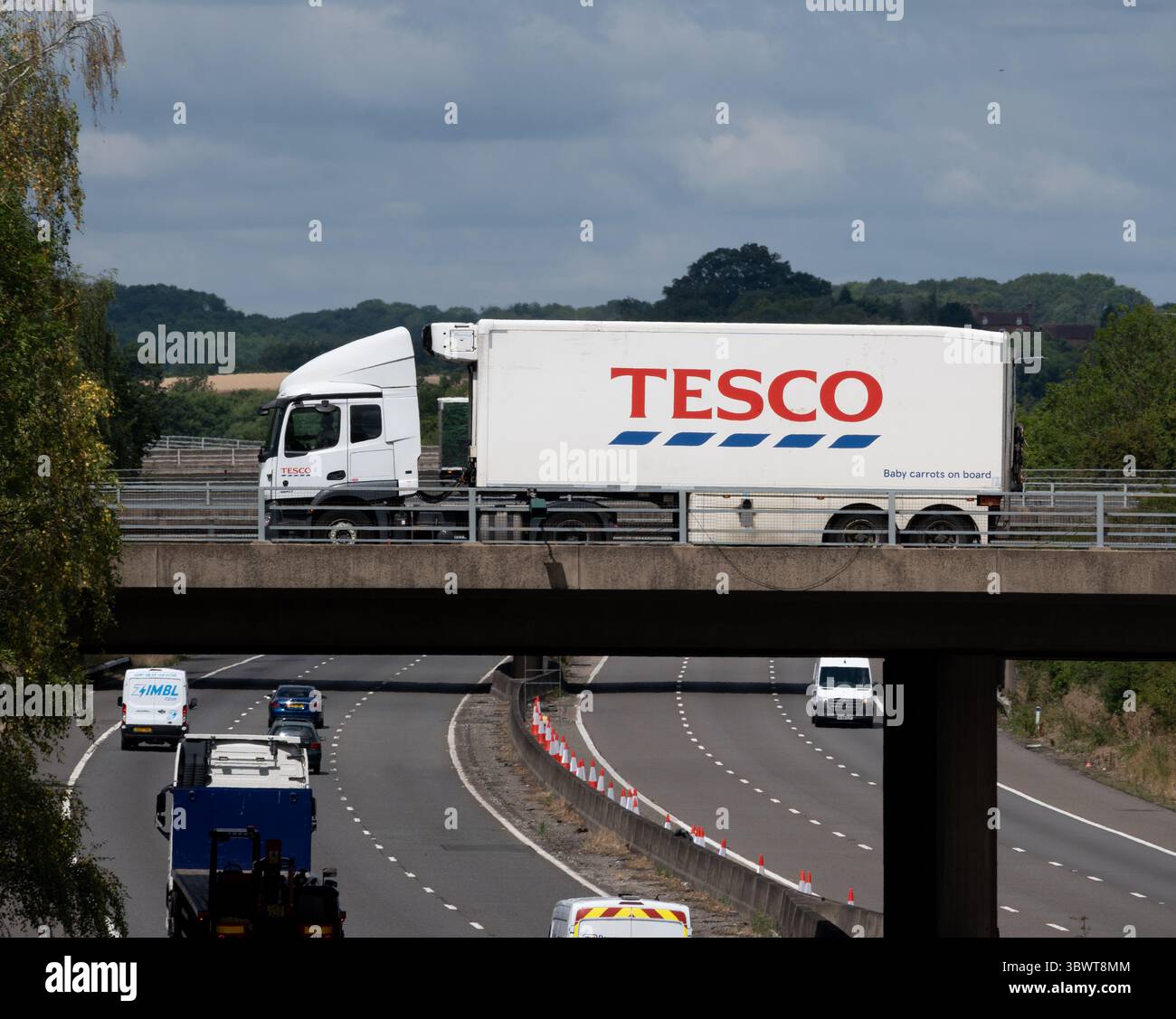 Tesco lorry crossing the M40 motorway at Longbridge Island, Warwick, UK ...