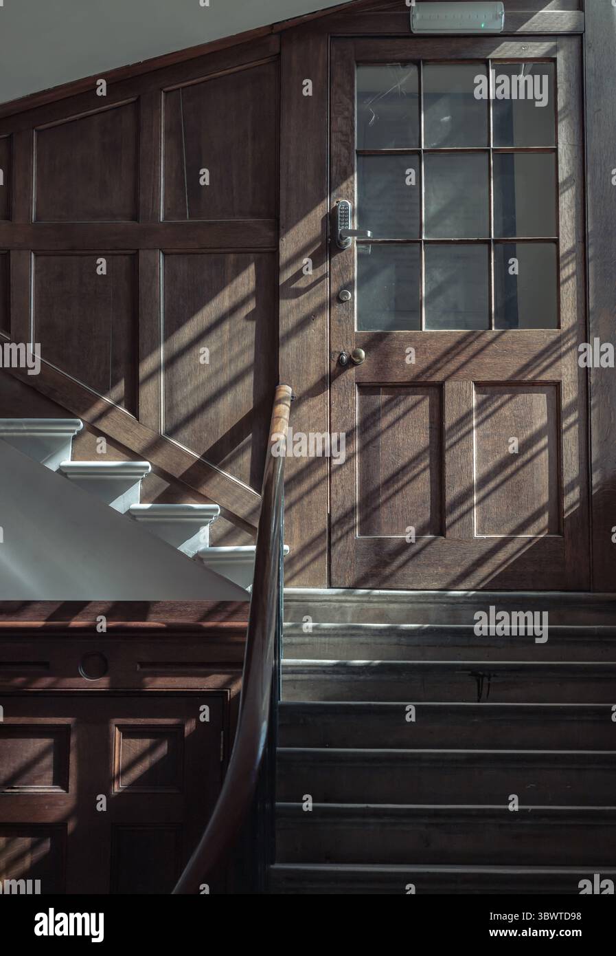 London, UK - May 13, 2025 - Sunlight streams through the large window ...