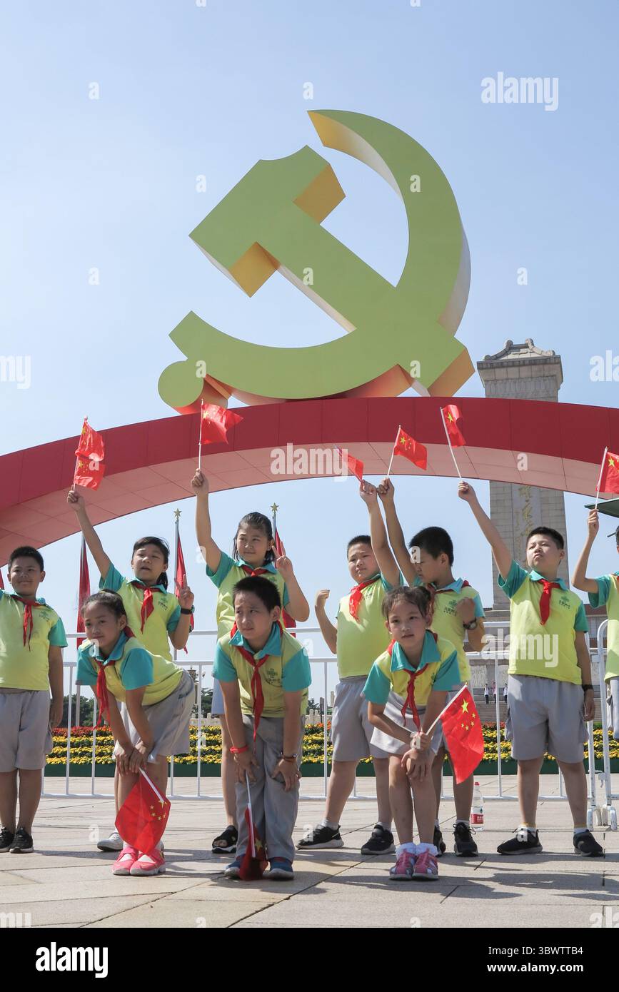 July 9, 2021, Beijing, China: A group of children with red scarves and ...