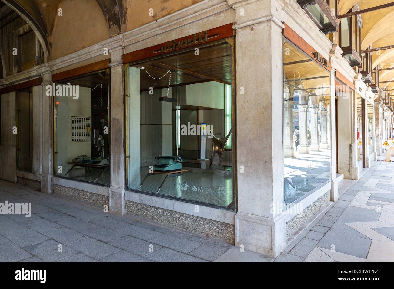 Showcase of the Olivetti shop. On display are three typewriters and a ...