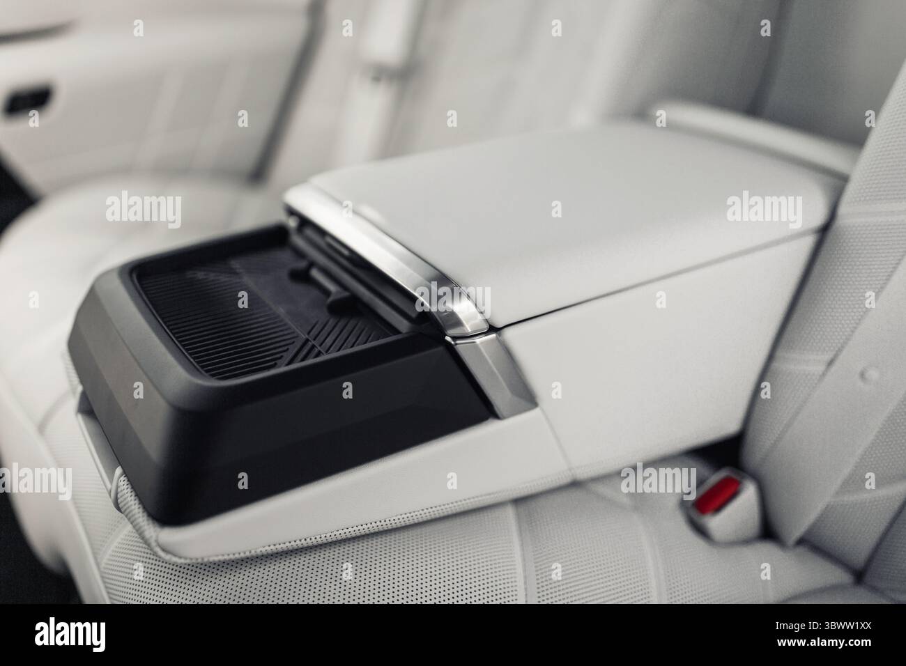 Luxury car armrest with white leather Stock Photo - Alamy