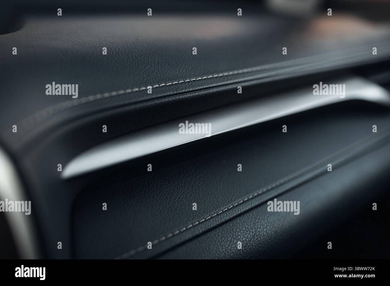 Modern car panel, with leather and backlight Stock Photo - Alamy