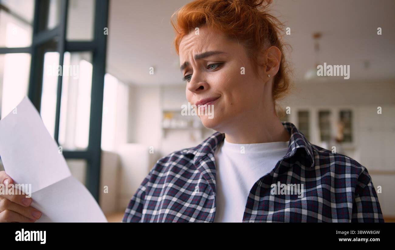 Caucasian woman receive bad news letter open envelope reading terrible ...