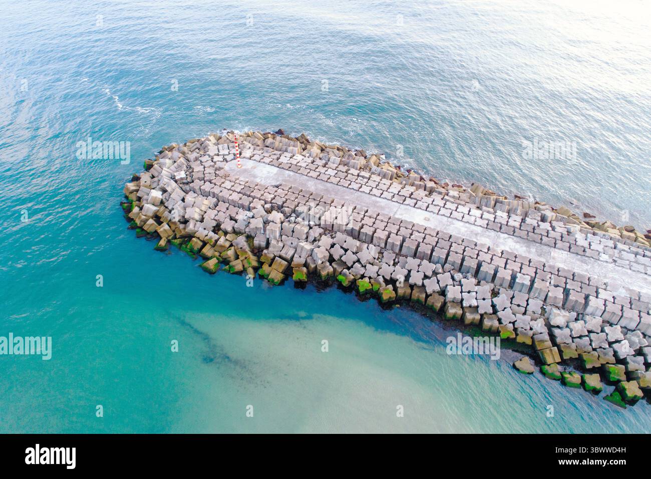Aerial View of a Concrete Breakwater in the Ocean, aerial drone top ...