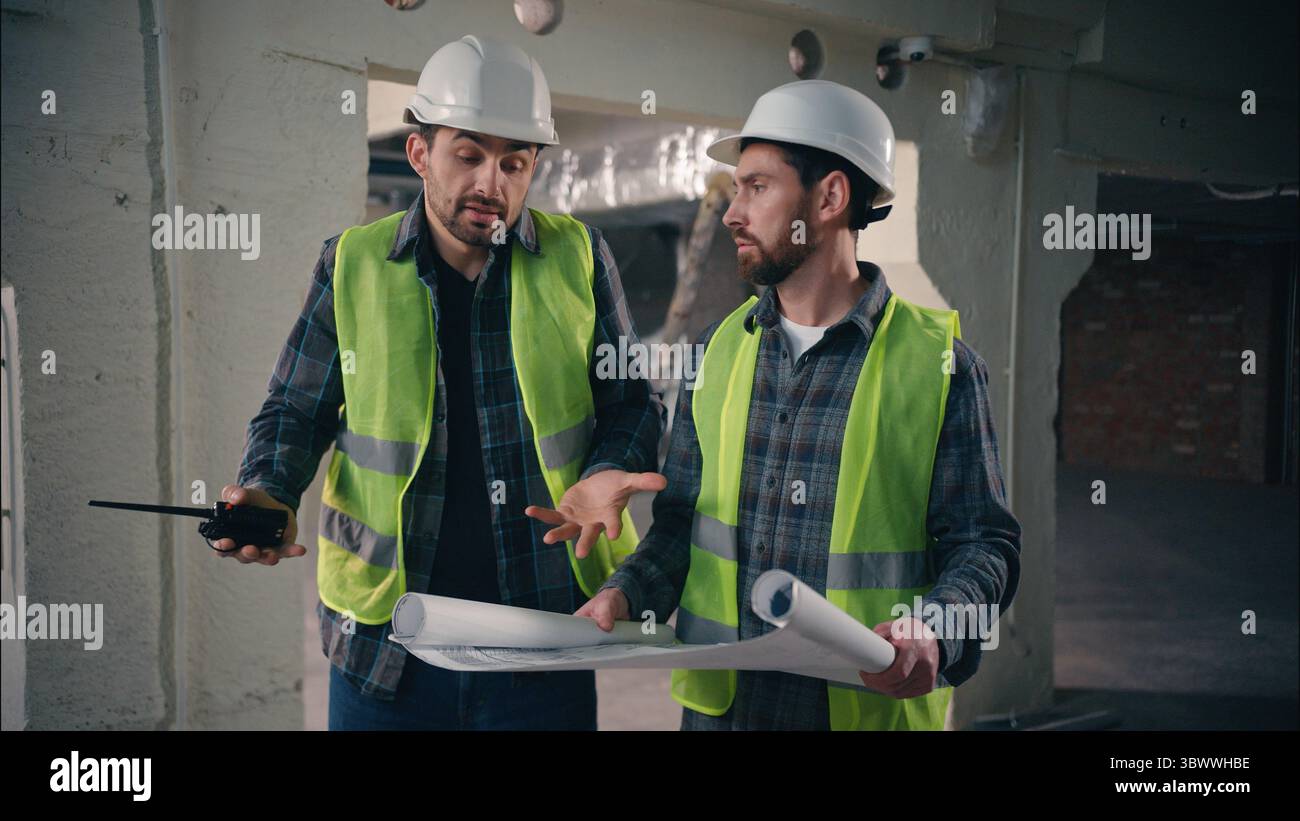 Teamwork two caucasian technicians inspect hi-res stock photography and ...