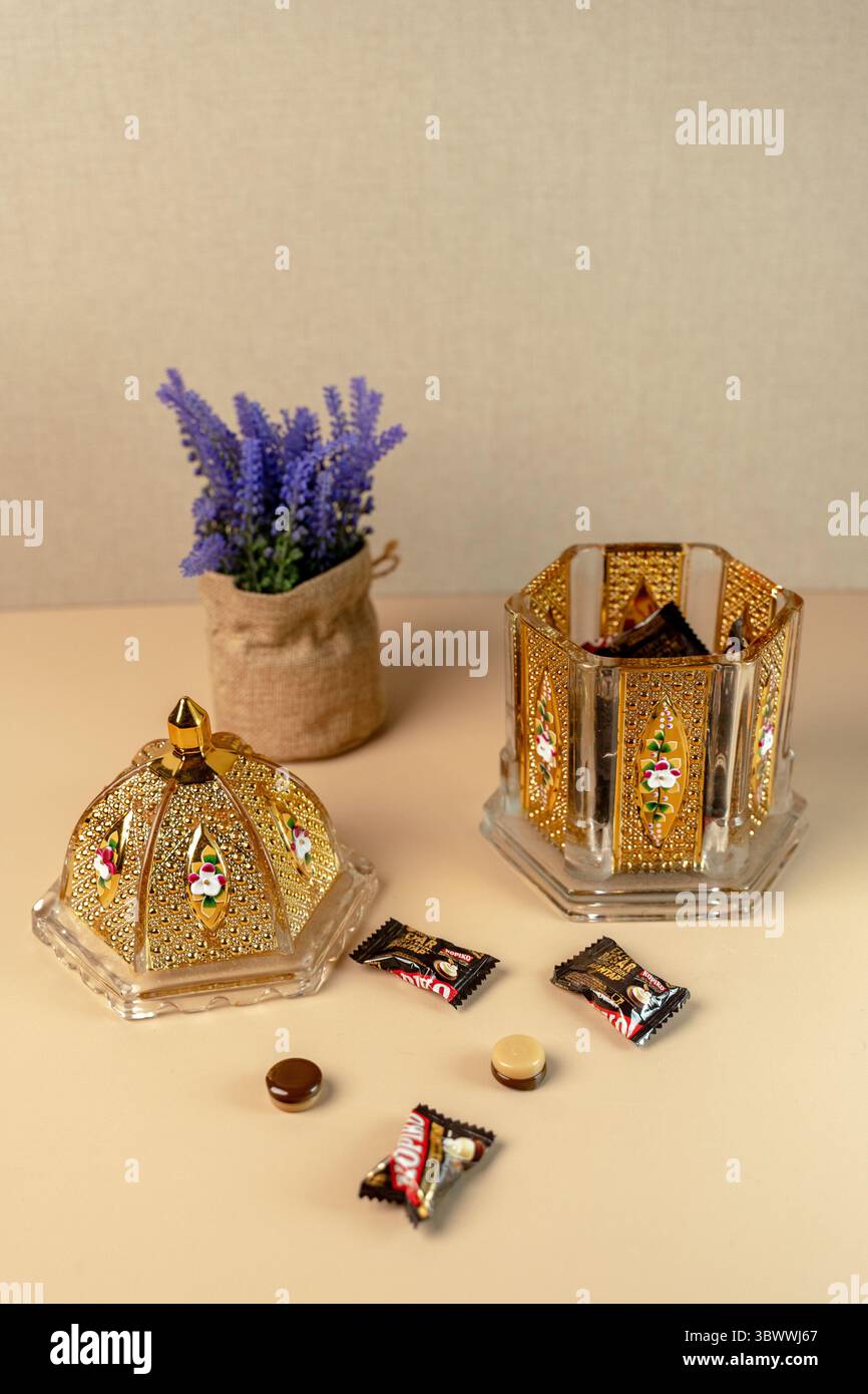 Jakarta, Indonesia, 17 July 2025: Ornate golden candy jar with Middle ...