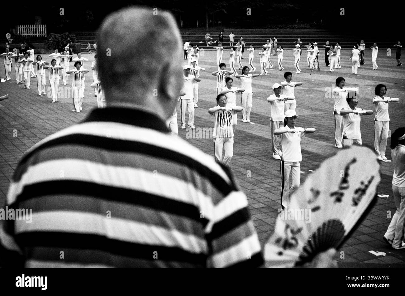 July 20, 2021, Beijing, Hebei, China: A man with a fan looks at ...