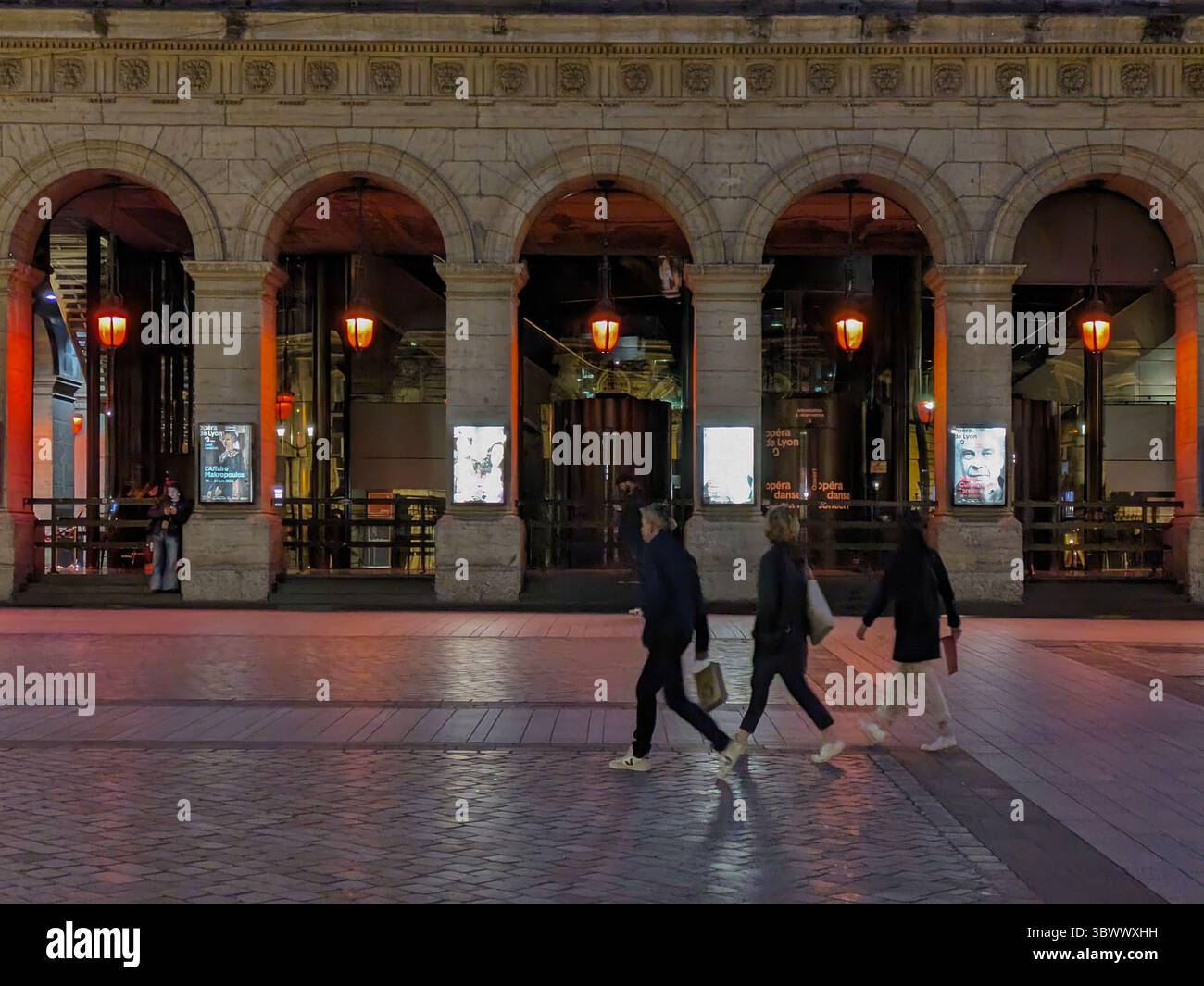 People walk near the Opera National de Lyon in central Lyon, France, on ...