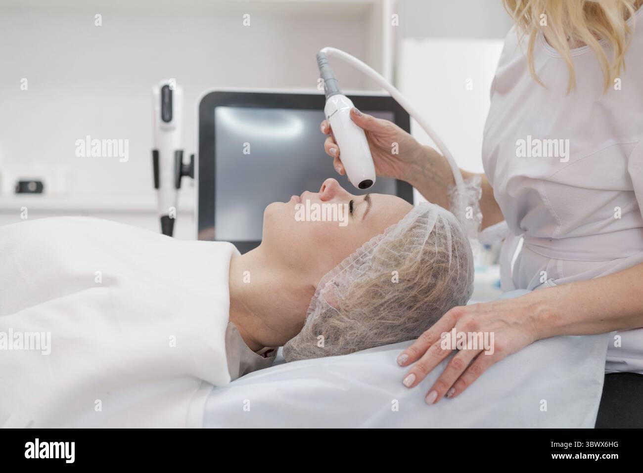 Rejuvenation facial treatment isolated on white. Model gets lifting ...