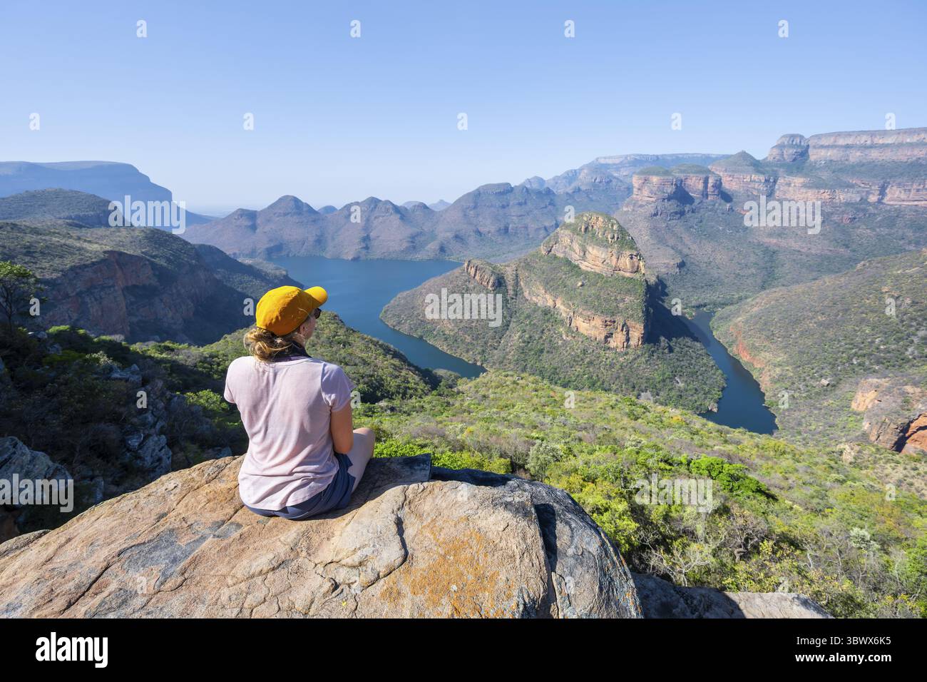 Hiker enjoying panorama, Blyde River Canyon with summit Three Rondawels ...