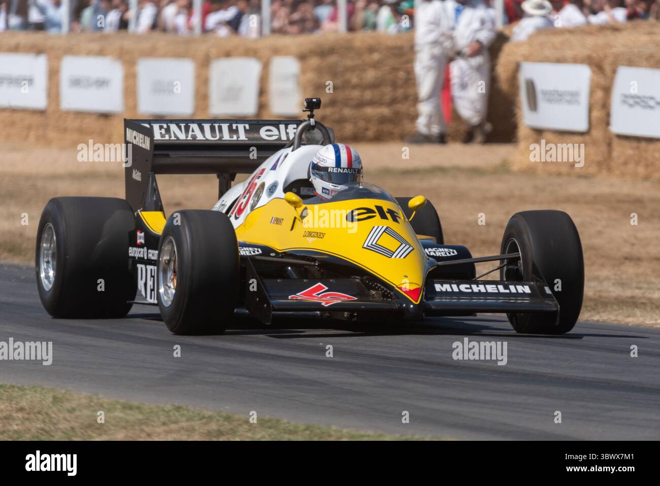 1983 Renault RE40 Formula 1 racing car driving up the hillclimb track ...
