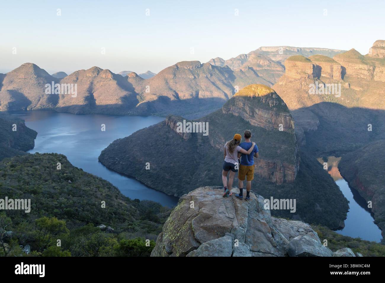 Two hikers enjoying panorama, Blyde River Canyon with Three Rondawels ...