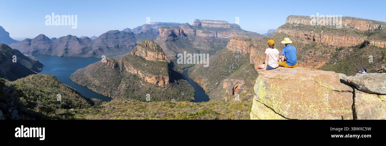 Two hikers enjoying panorama, Blyde River Canyon with Three Rondawels ...