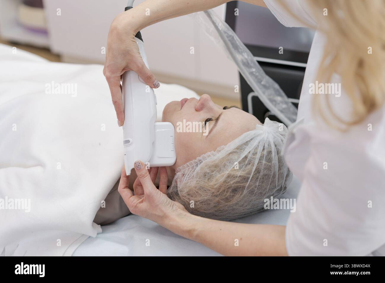 Rejuvenation facial treatment isolated on white. Model gets lifting ...