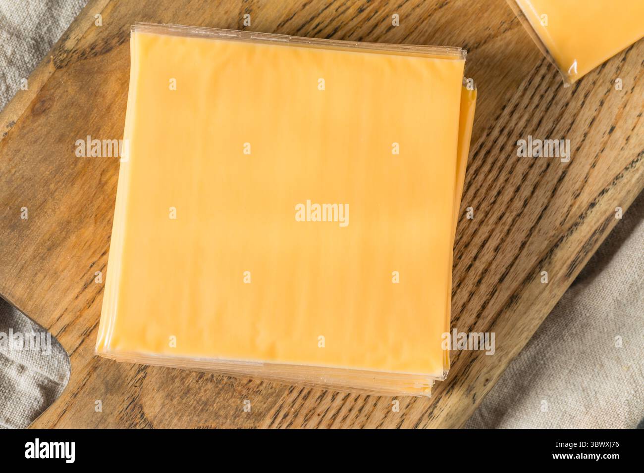 Unhealthy Wrapped American Cheese Slices in a Pile Stock Photo - Alamy