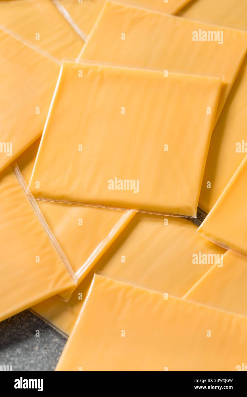 Unhealthy Wrapped American Cheese Slices in a Pile Stock Photo - Alamy