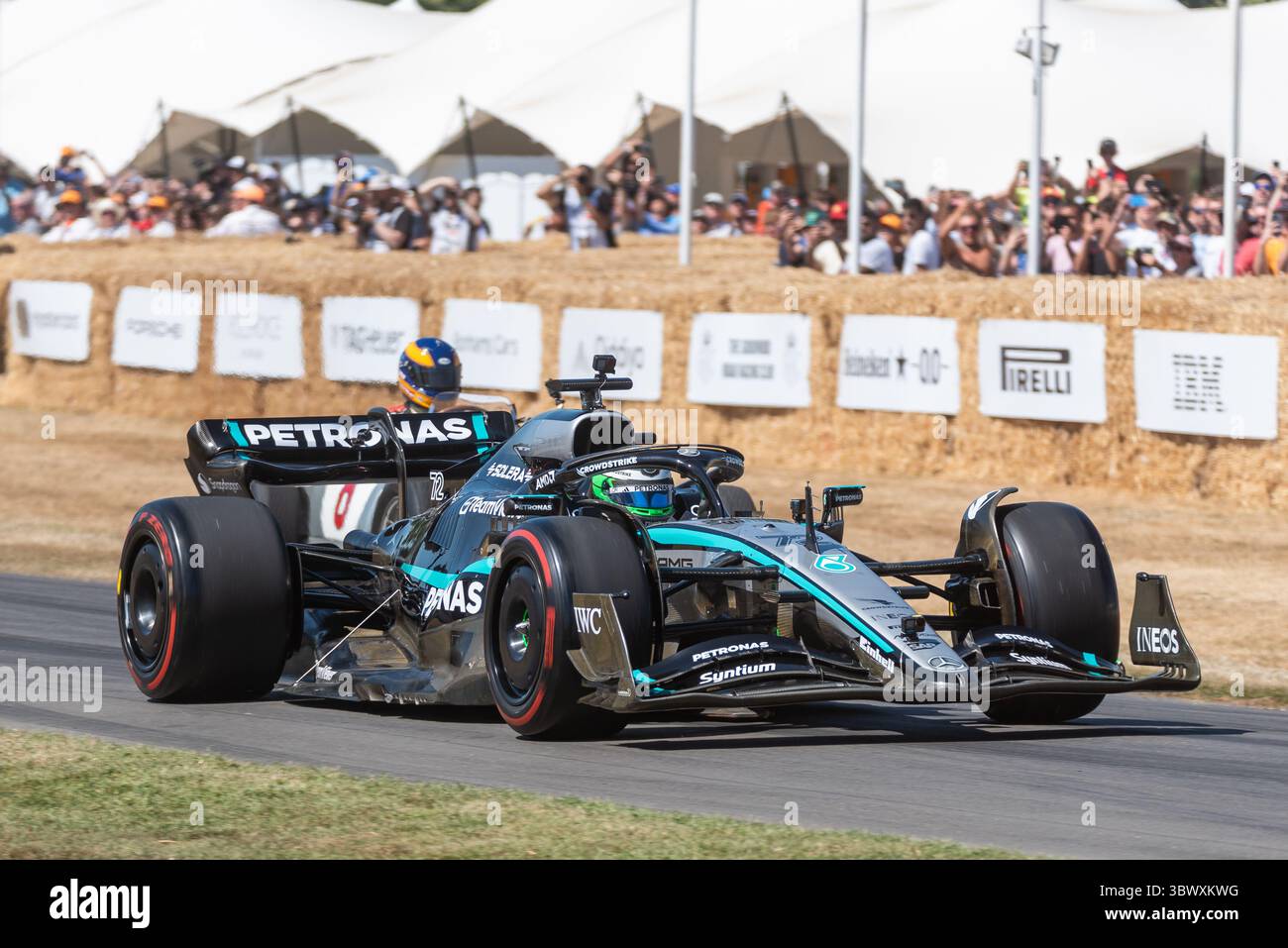 2022 Mercedes-AMG F1 W13 E Performance car driving up the hillclimb ...