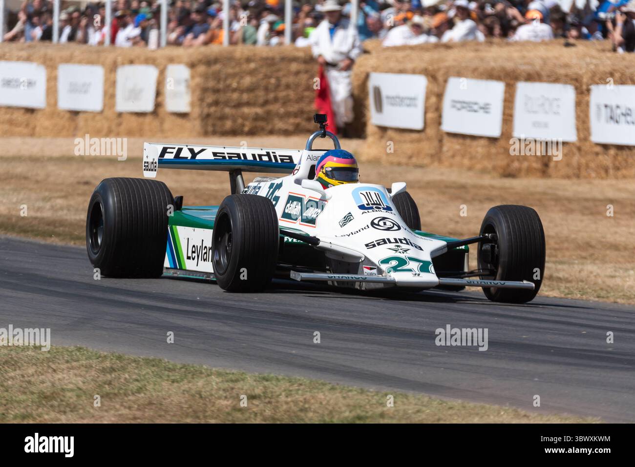 1979 Williams FW07 Formula 1 racing car driving up the hillclimb track ...