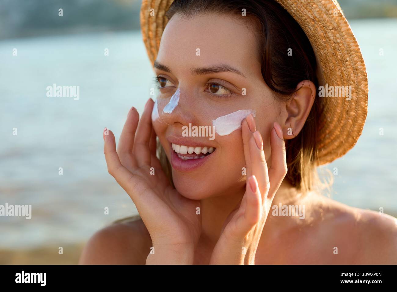 Suntan lotion woman applying sunscreen solar cream. Beautiful happy ...