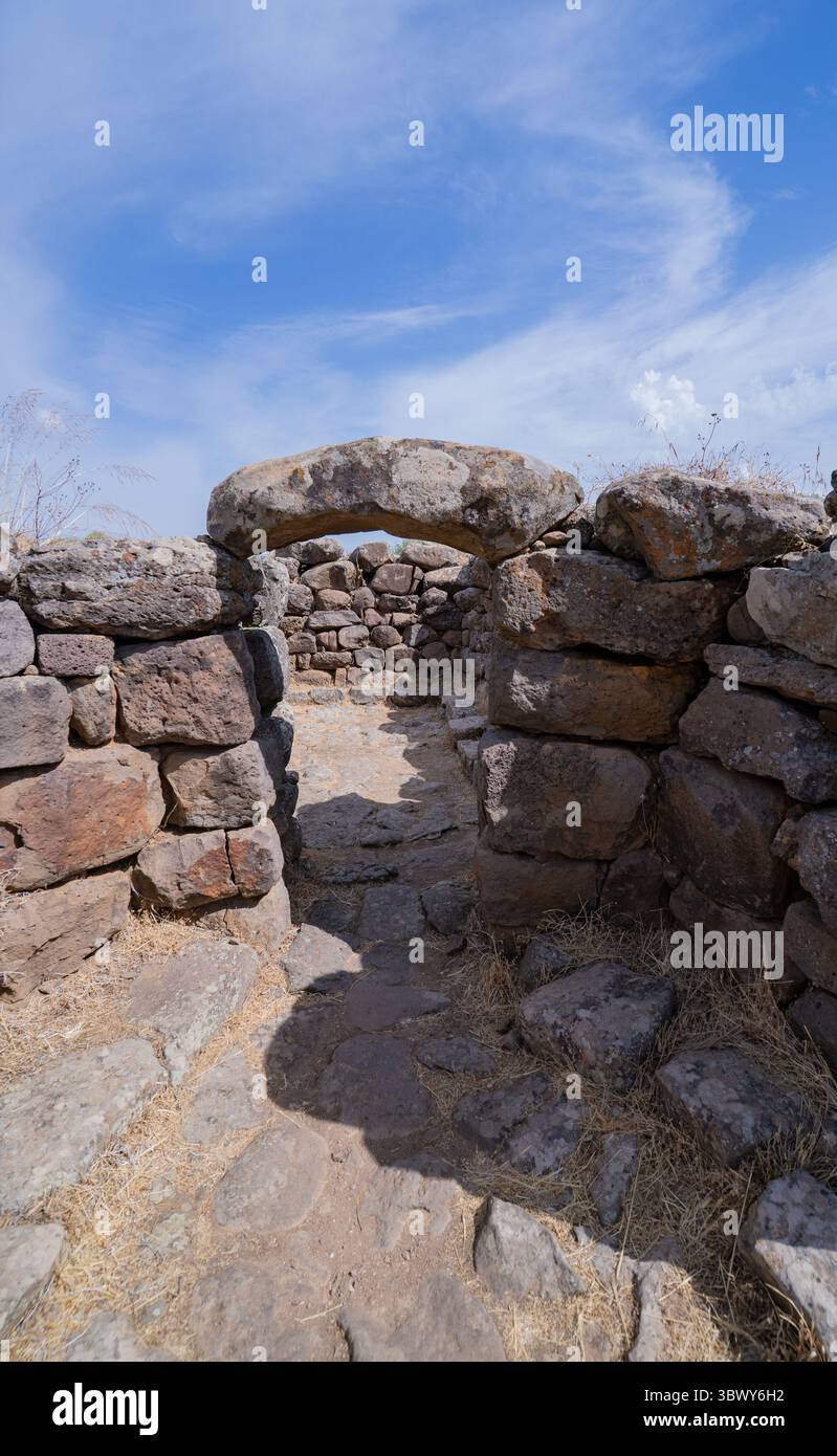 Remains of prehistoric stone huts in the Nuragic village of Serra ...