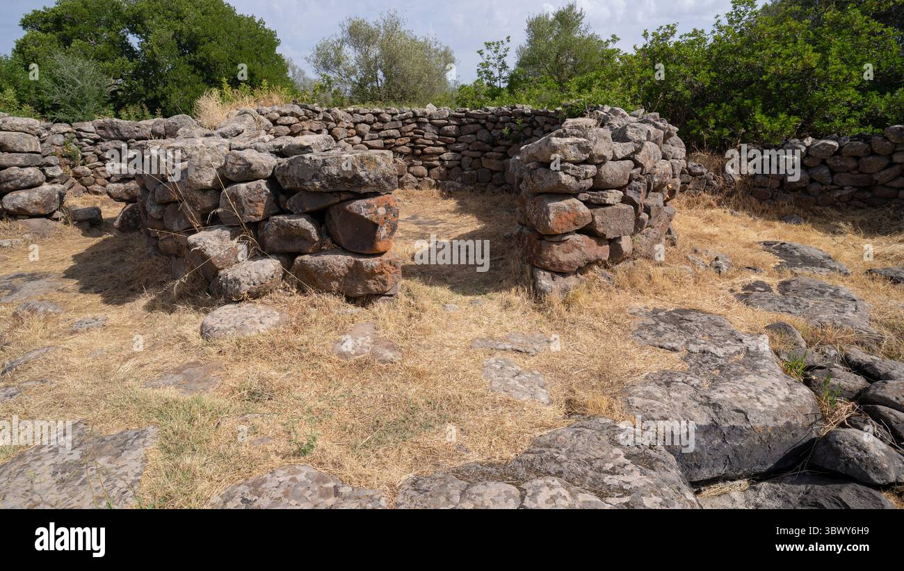 Remains of prehistoric stone huts in the Nuragic village of Serra ...