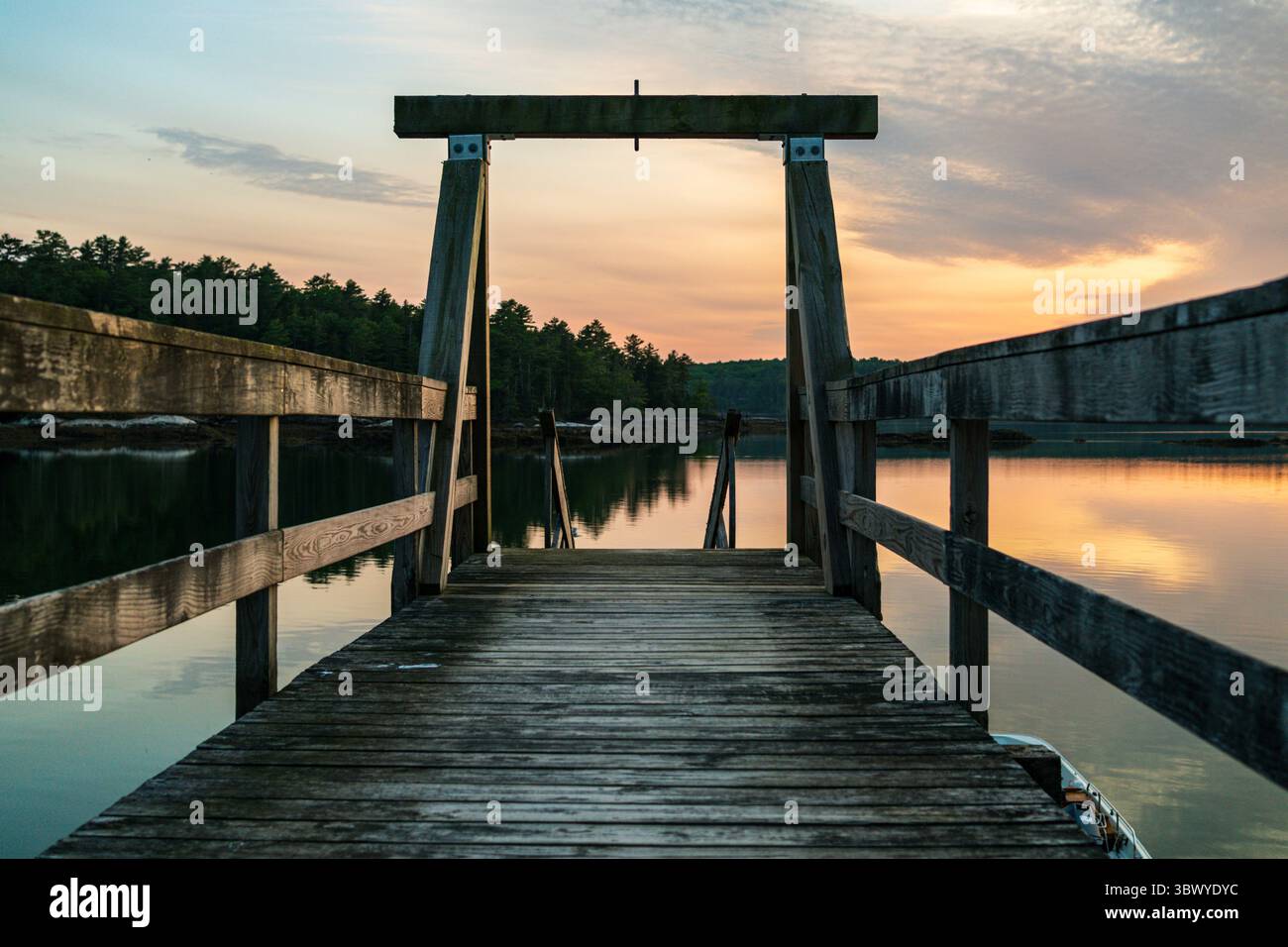 Wooden boardwalk and boat ramp Stock Photo - Alamy