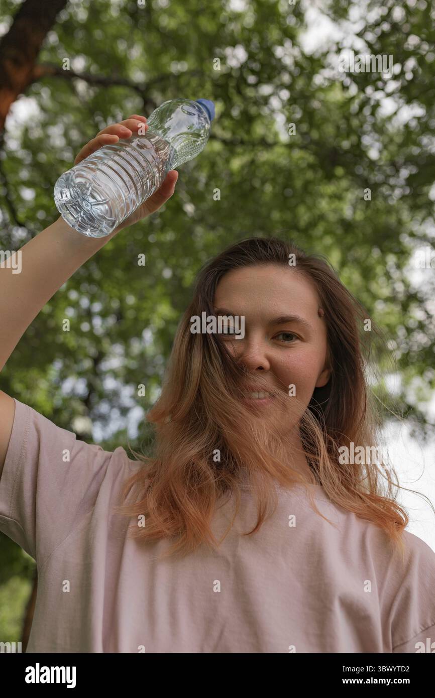 Woman lifting clear water hi-res stock photography and images - Alamy