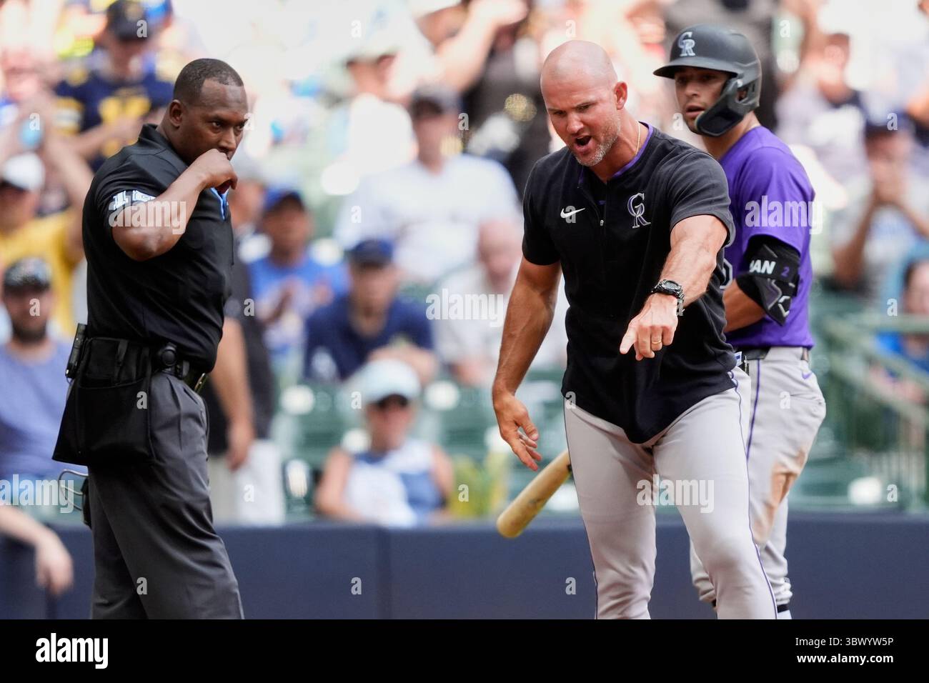 FILE - Colorado Rockies interim manager Warren Schaeffer, right ...