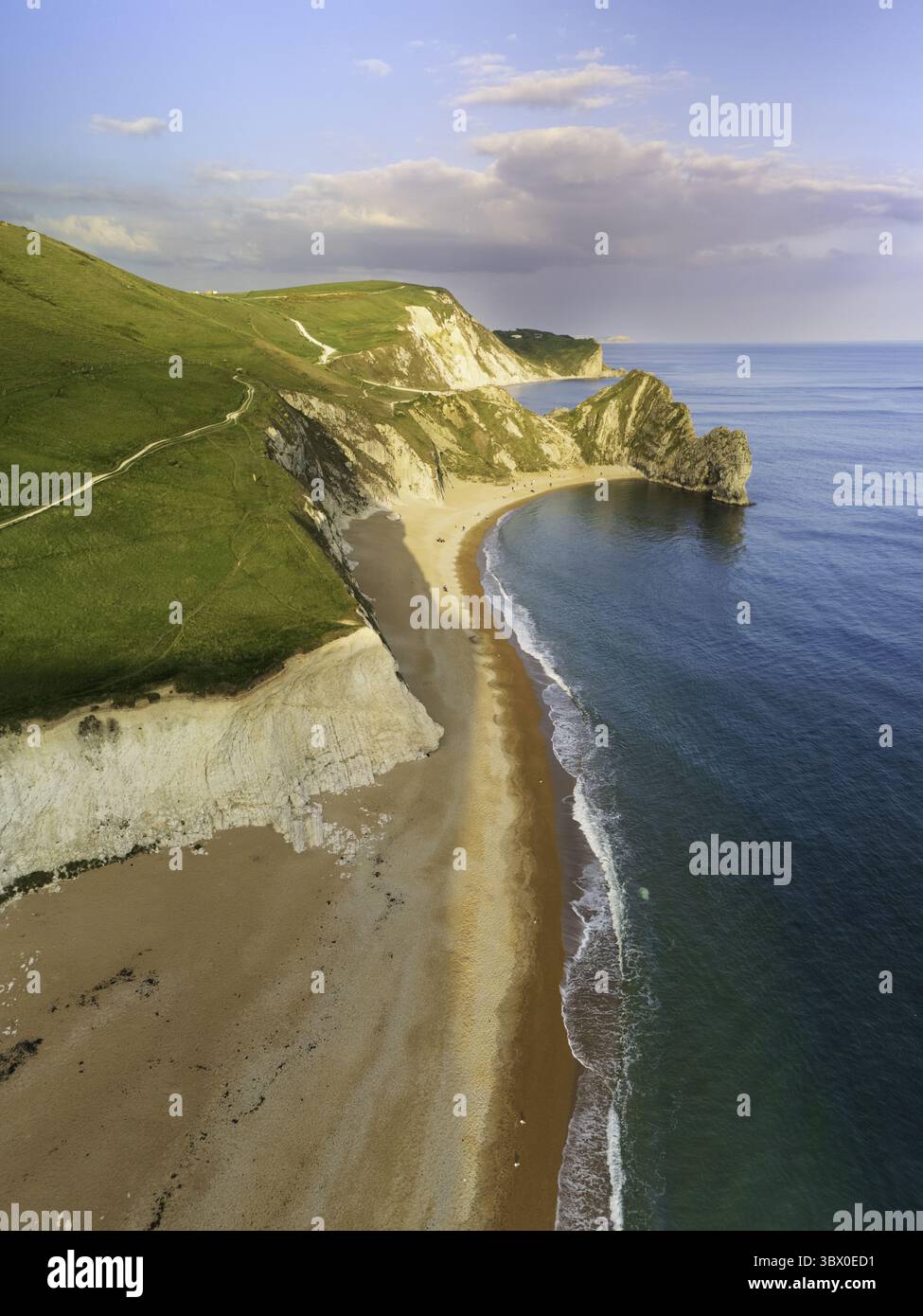 Aerial view of Durdle Door's dramatic arch against the turquoise sea ...