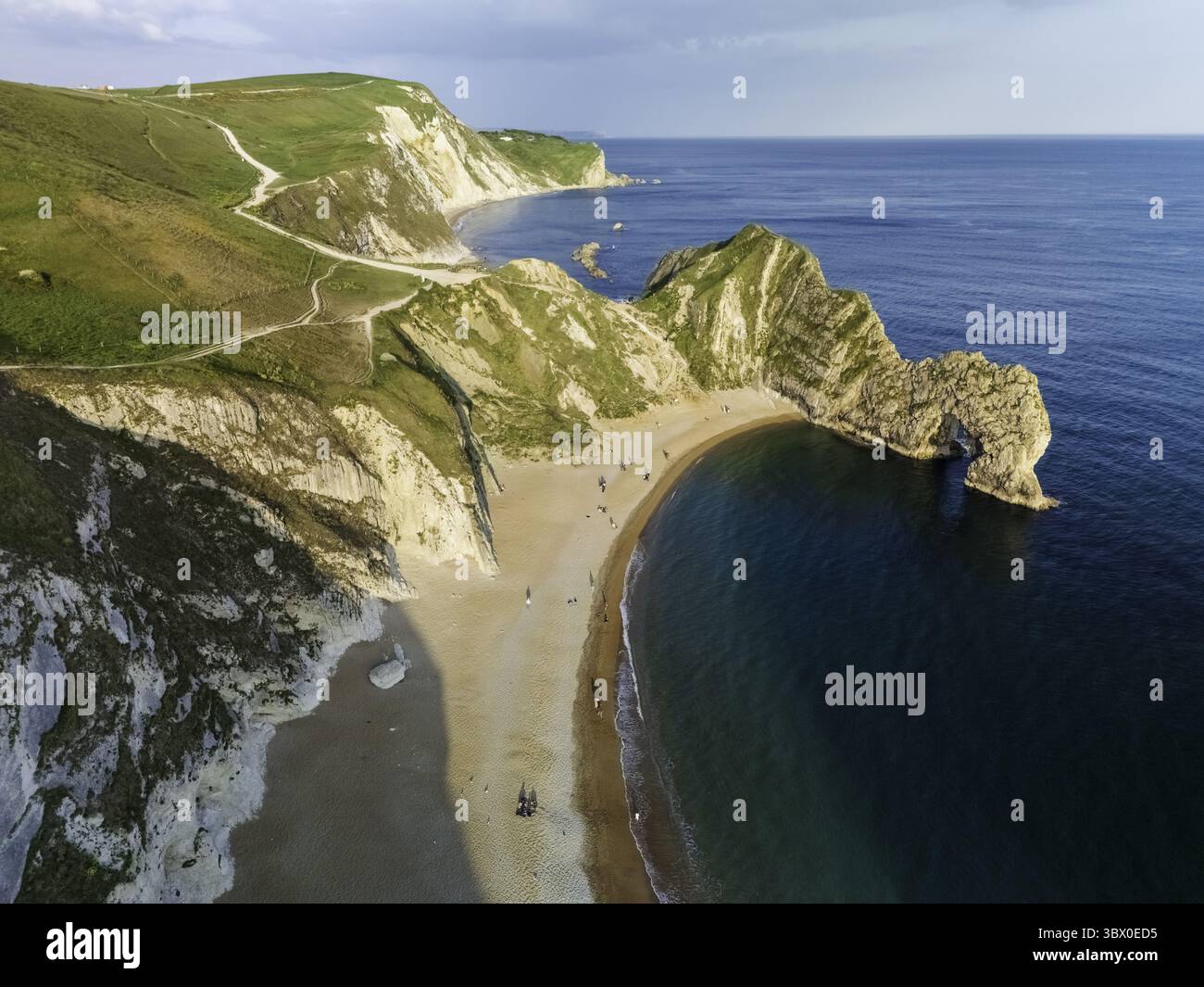 Aerial view of Durdle Door's majestic arch meets the turquoise sea ...
