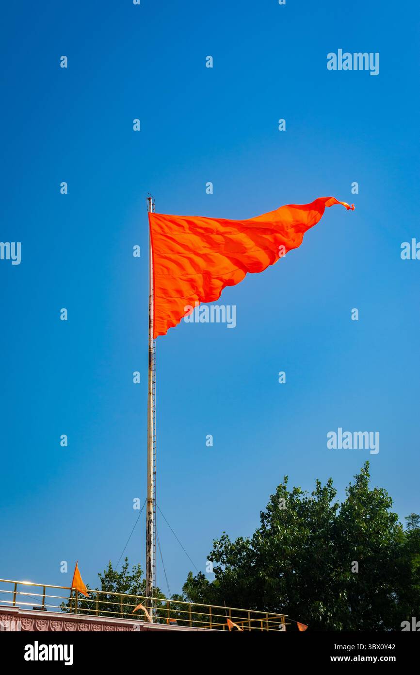 Hindu flag fluttering against a clear blue sky Stock Photo - Alamy